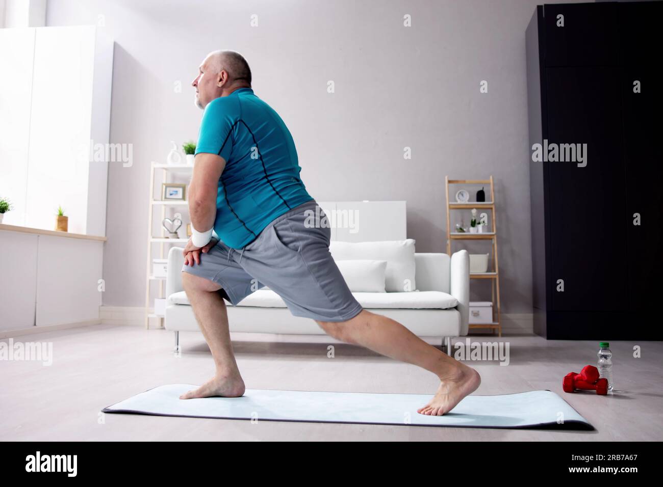 Funny Man Fitness Exercise Workout In Home Gym Stock Photo - Alamy