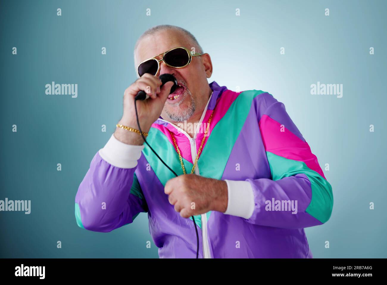 Rich Man In Disco Club Singing. Gold Chain Stock Photo - Alamy