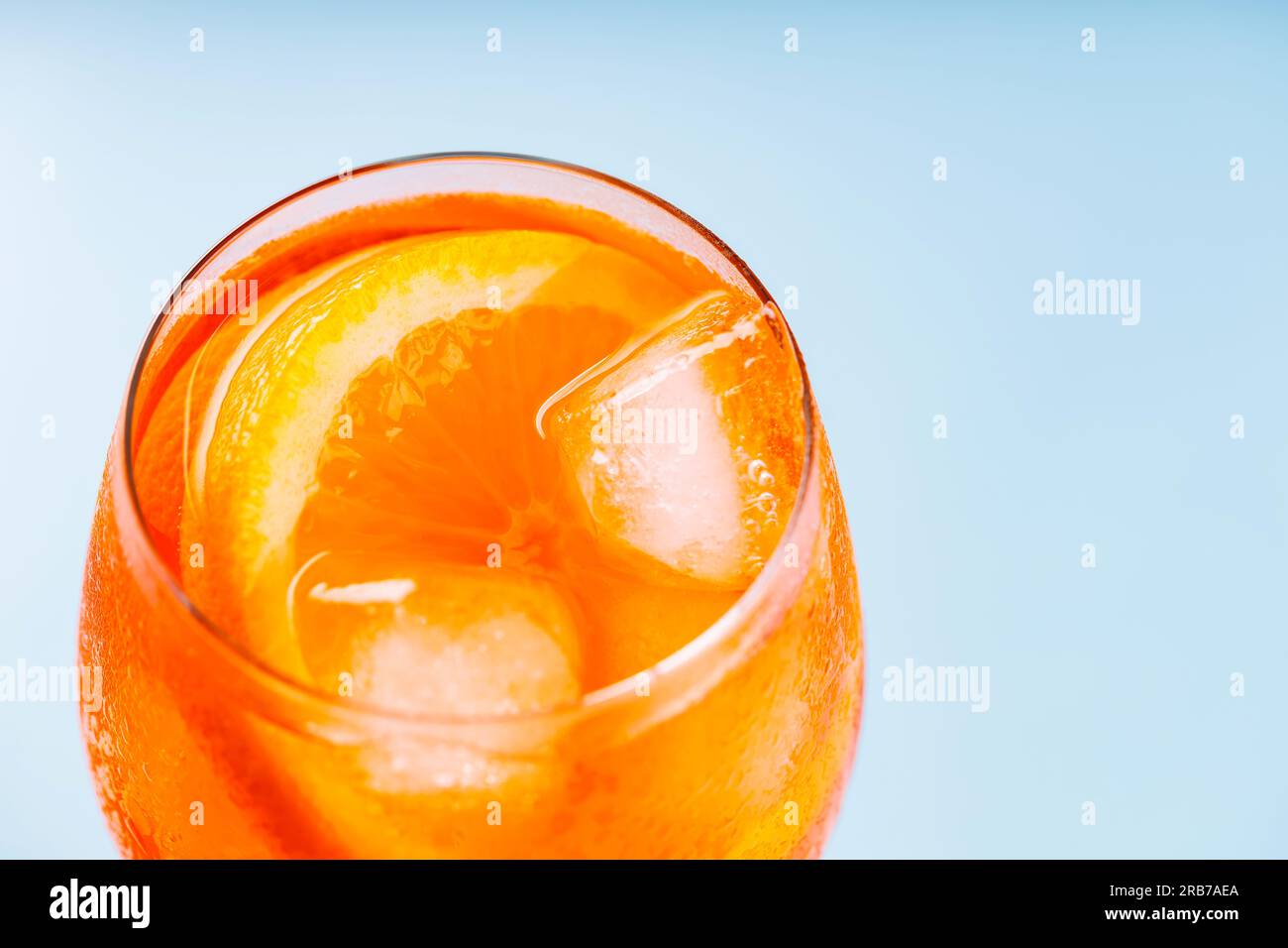 Aperol Spritz cocktail in glass on a blue background. Cocktail Aperol ...