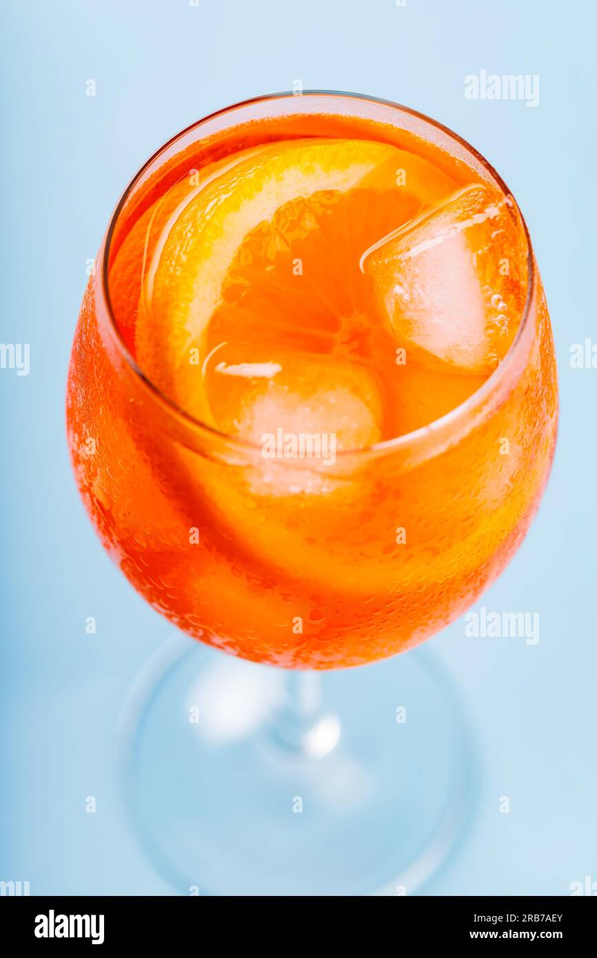 Aperol Spritz cocktail in glass on a blue background. Cocktail Aperol ...