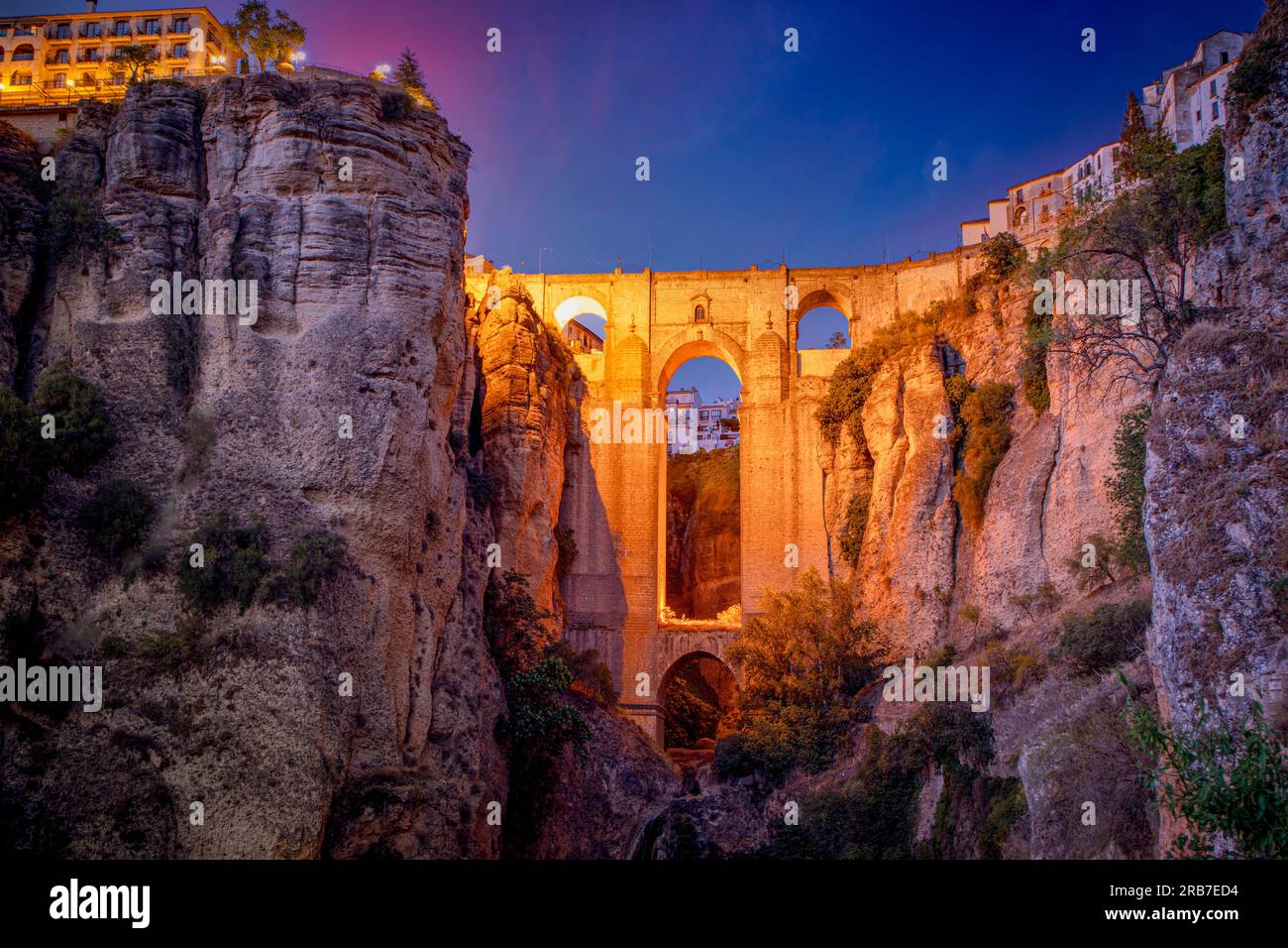 Spectacular view of the New Bridge in Ronda, Malaga, Spain, illuminated ...