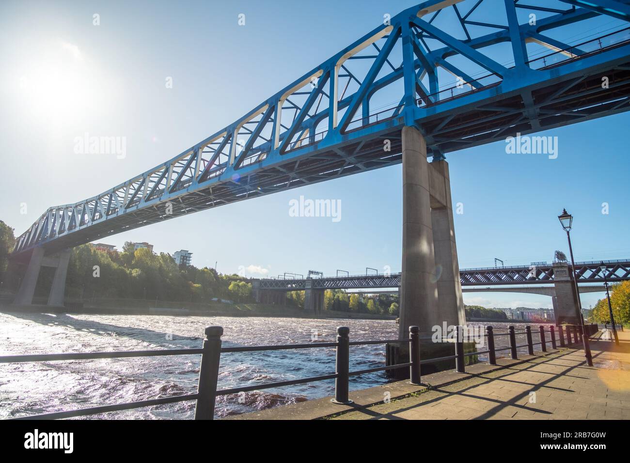 Quayside along Tyne River, in Newcastle with King Edward VII Bridge ...