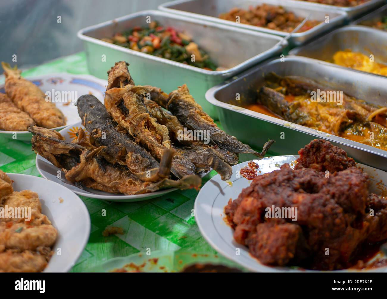 Cooked vegetables and fried catfish ready to eat, delicious street food ...