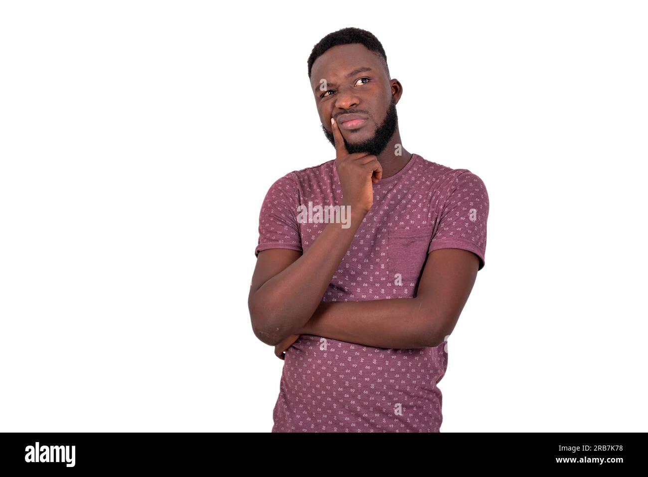 portrait of a handsome young man thinking with crossed arm and raised ...