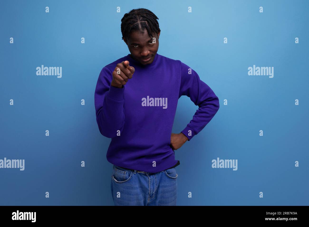 emotional thinking black american young man with dreadlocks in casual ...