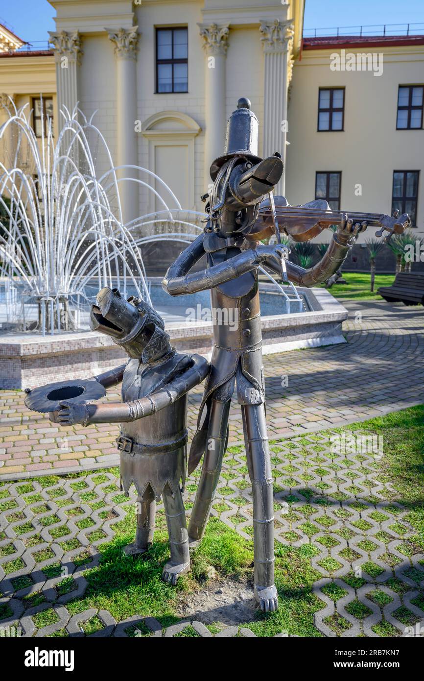 A sculpture made of pipe segments depicting stray dog musicians ...