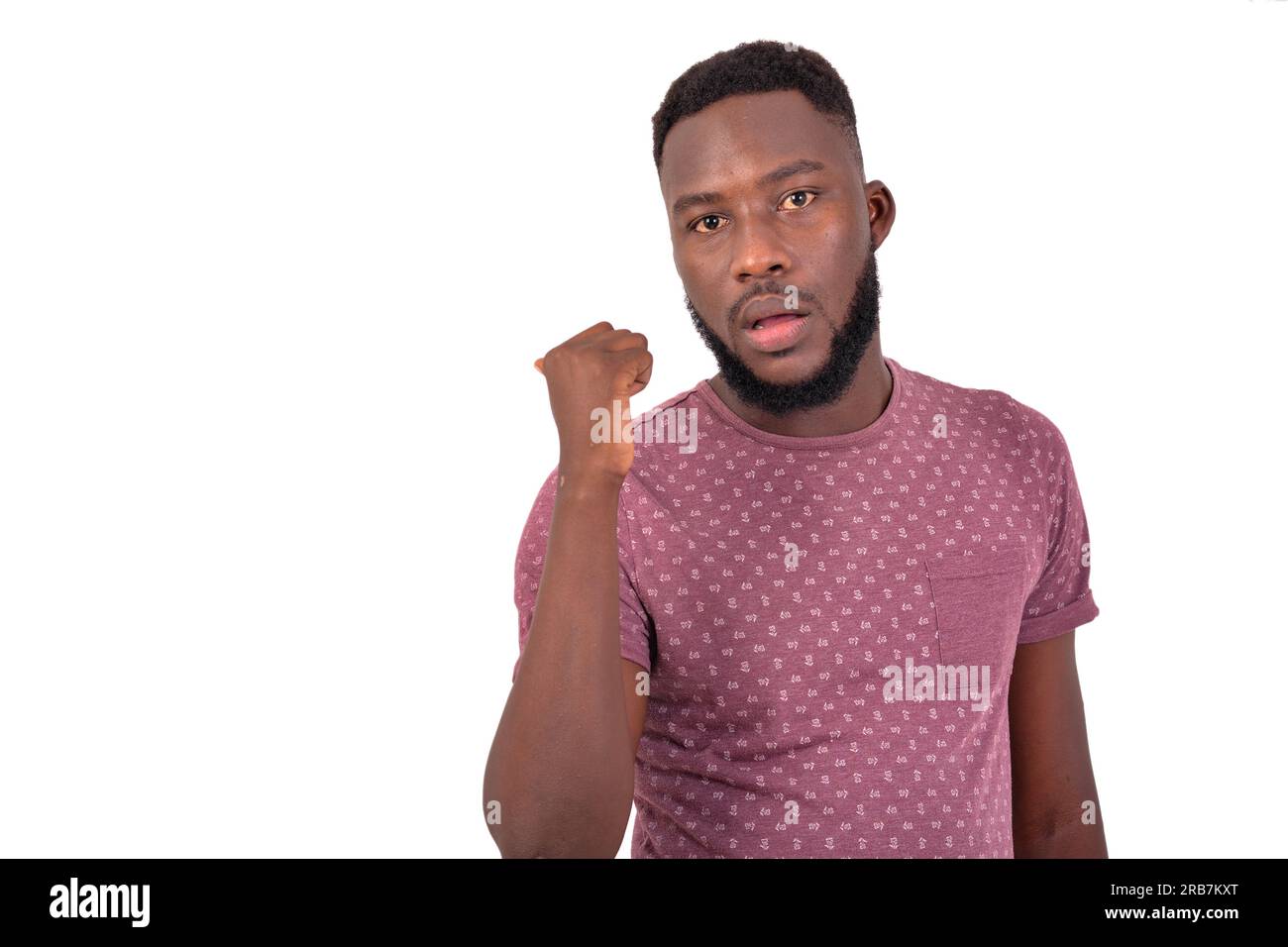 portrait of a handsome young man pointing thumb back Stock Photo - Alamy
