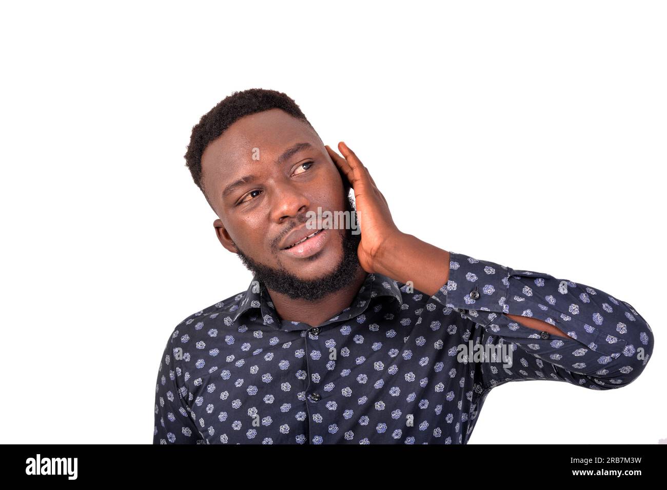 portrait of a handsome young man holding hand on his ear Stock Photo ...