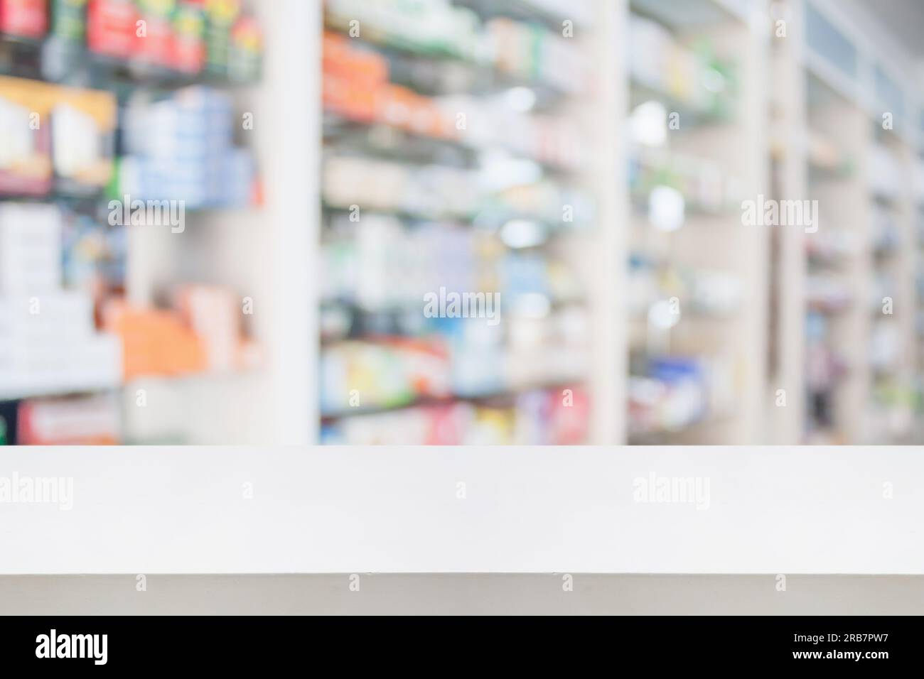 pharmacy store counter table top with blur medicine on shelves in the ...