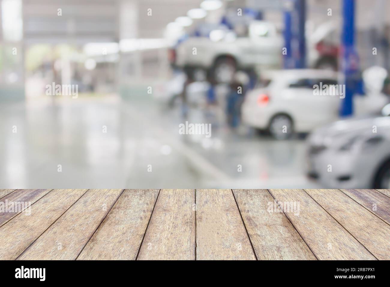 Wood table top with blur garage background, for product display or ...