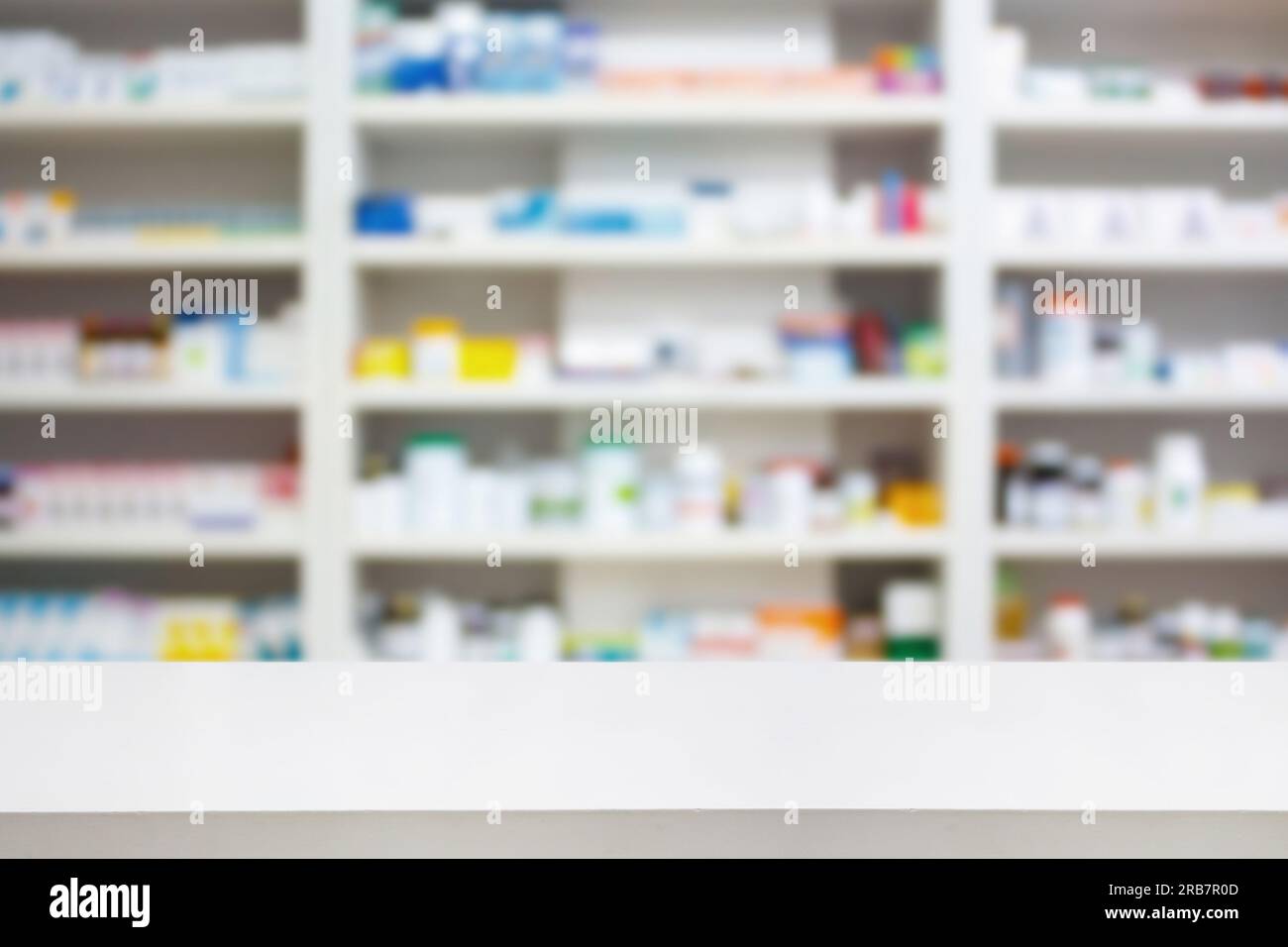 pharmacy store background with white table counter Stock Photo - Alamy