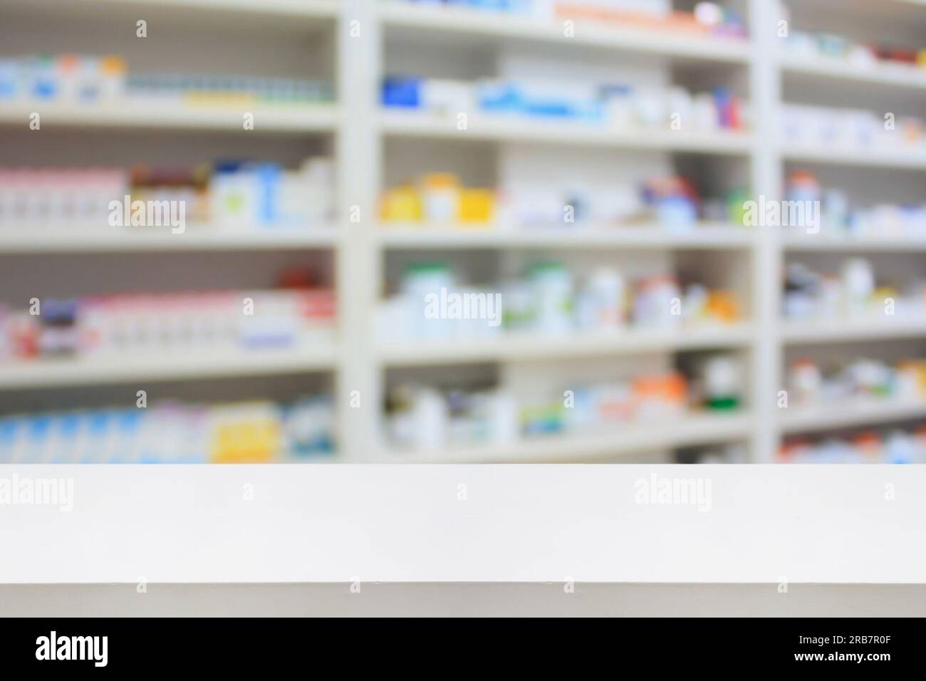 Pharmacy counter store table background with medicine shelves in ...