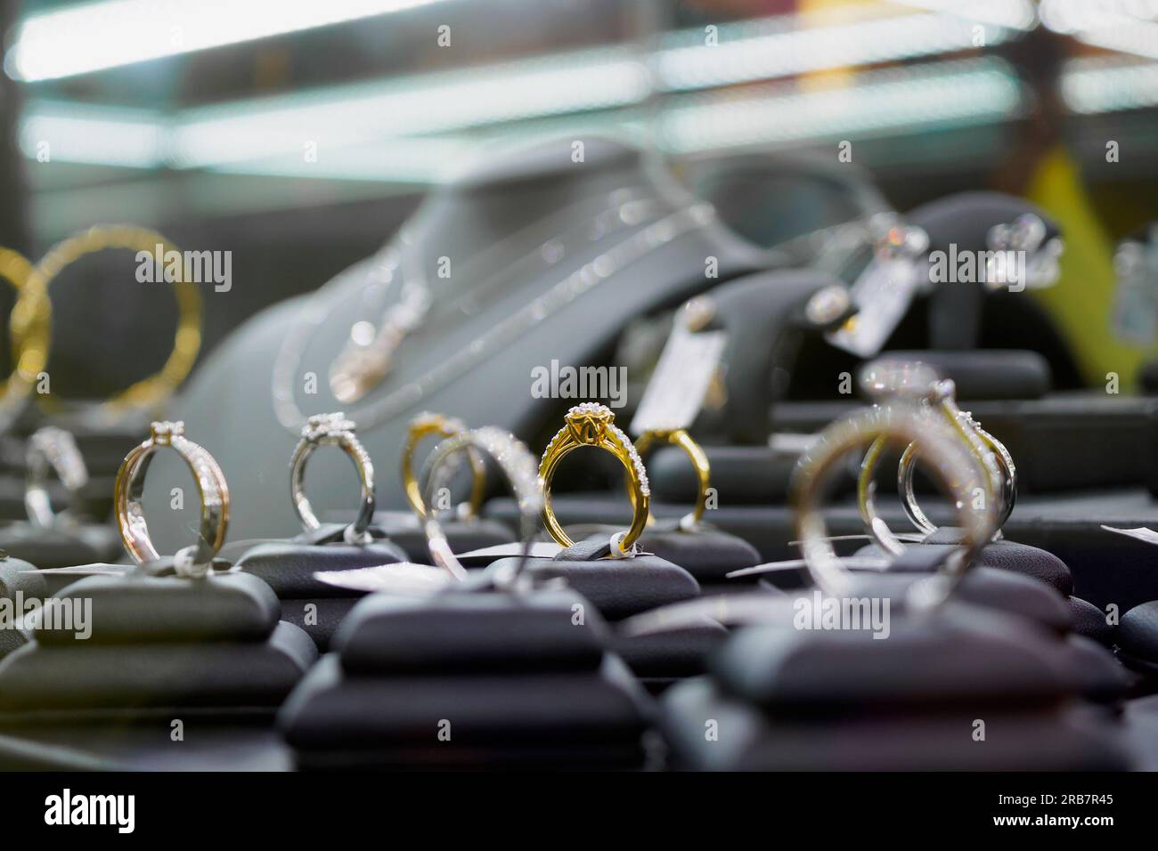 Jewelry diamond rings and necklaces show in luxury retail store window ...