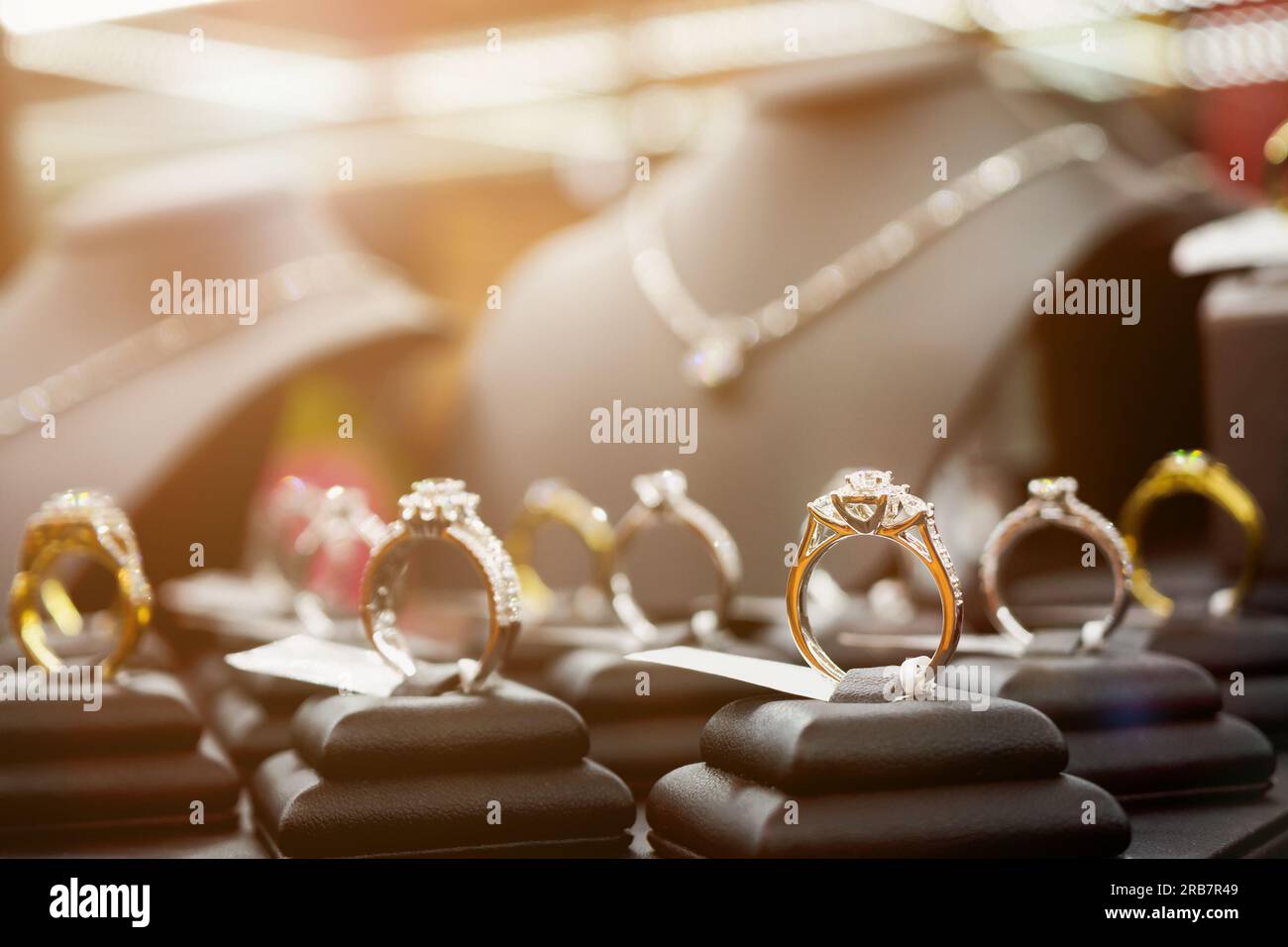 Jewelry diamond rings and necklaces show in luxury retail store window ...