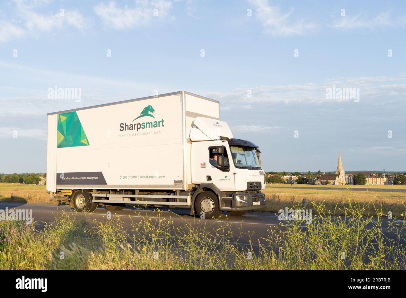 white truck with logo of Sharpsmart drives on A2 London greenwich UK ...