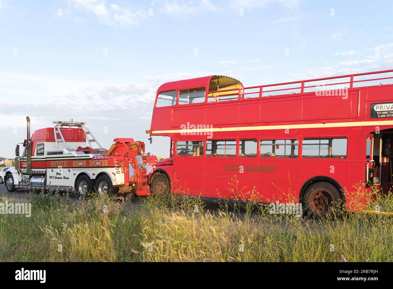 red open top london bus is being recovered after a breakdown, London UK ...