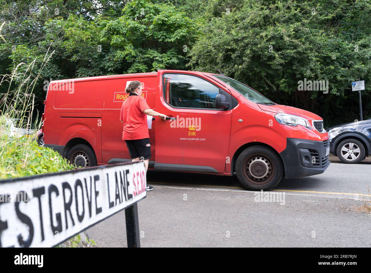 Royal mail parcel woman hi-res stock photography and images - Alamy