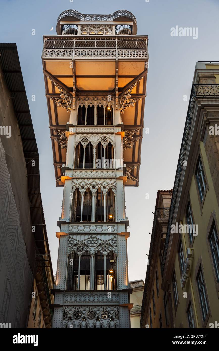 Elevador de Santa Justa or Do Carmo with the lighting on at sunset ...