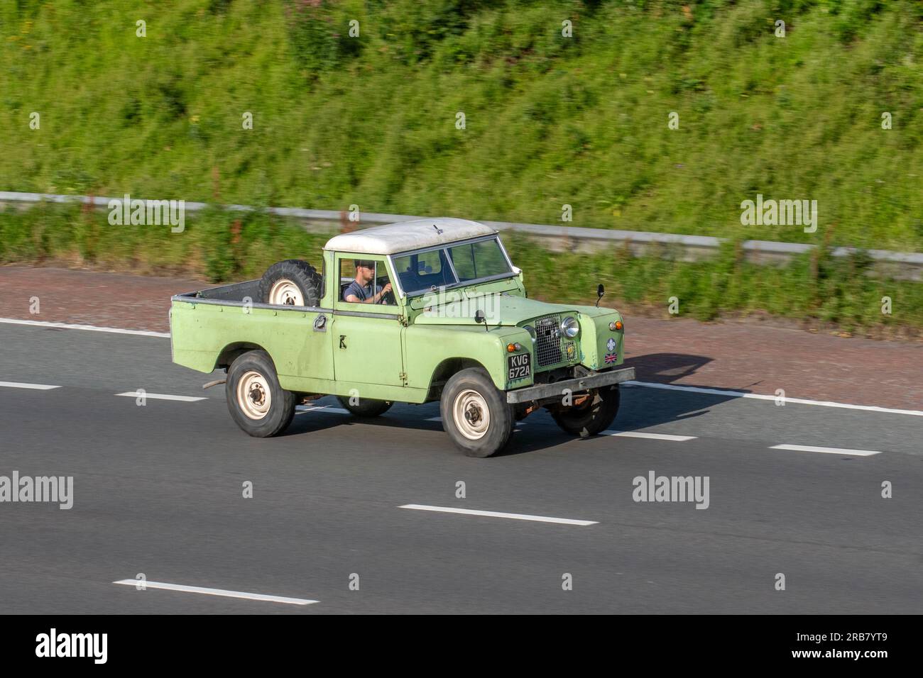 1960 60s sixties Green Land Rover travelling at speed on the M6 ...