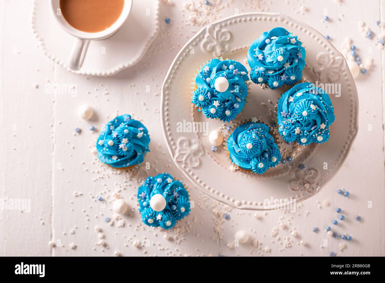 Delicious and sweet cupcakes with blue whipped cream. Perfect blue ...