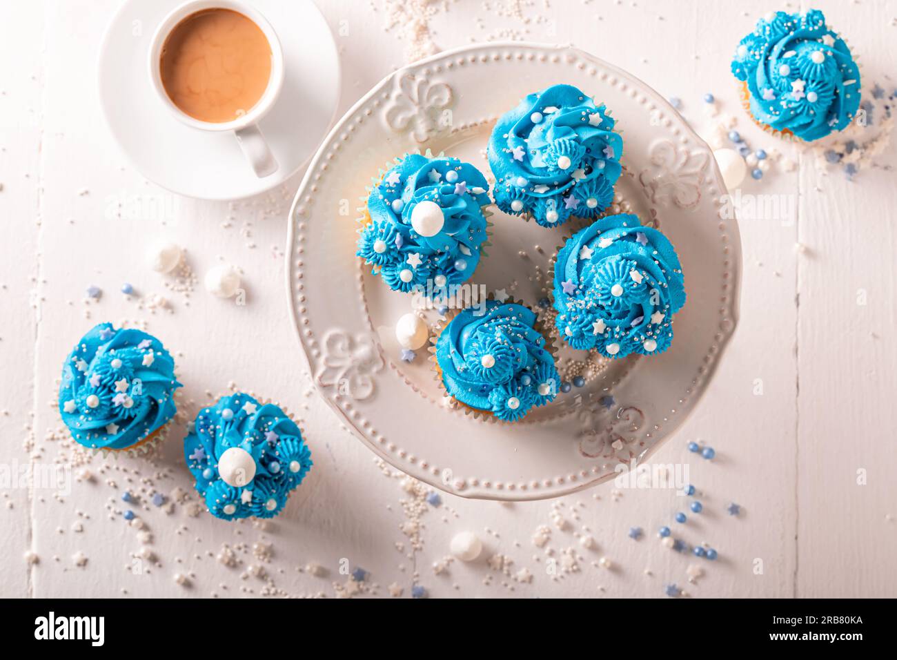 Homemade and unique cupcakes with blue whipped cream. Perfect blue ...