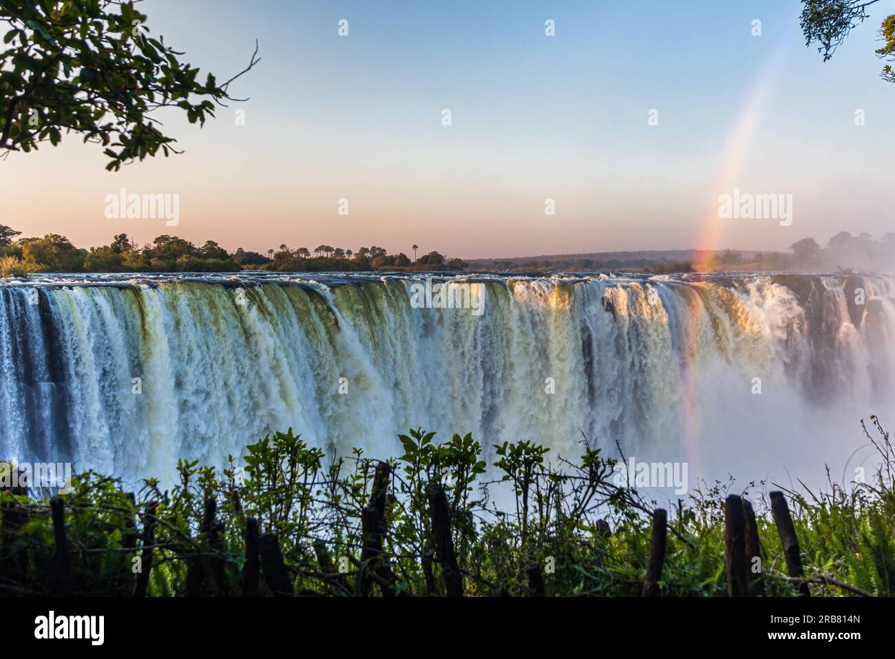 Scenic view of Victoria Falls with rainbow in Matabeleland North ...