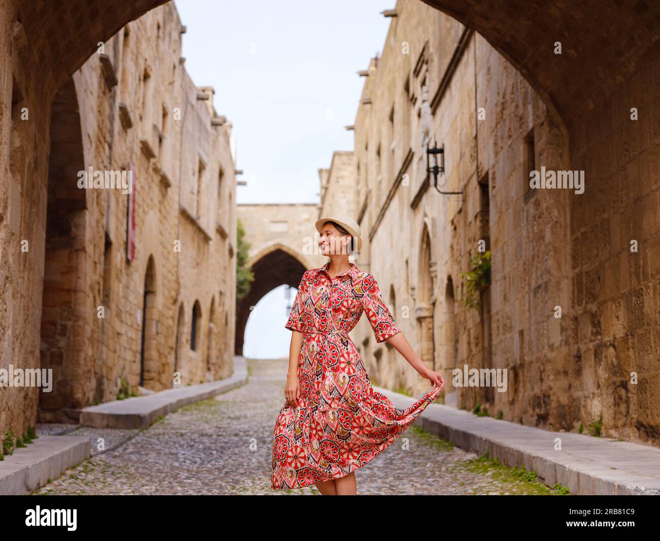 summer trip to Rhodes island, Greece. Young Asian woman in ethnic red ...