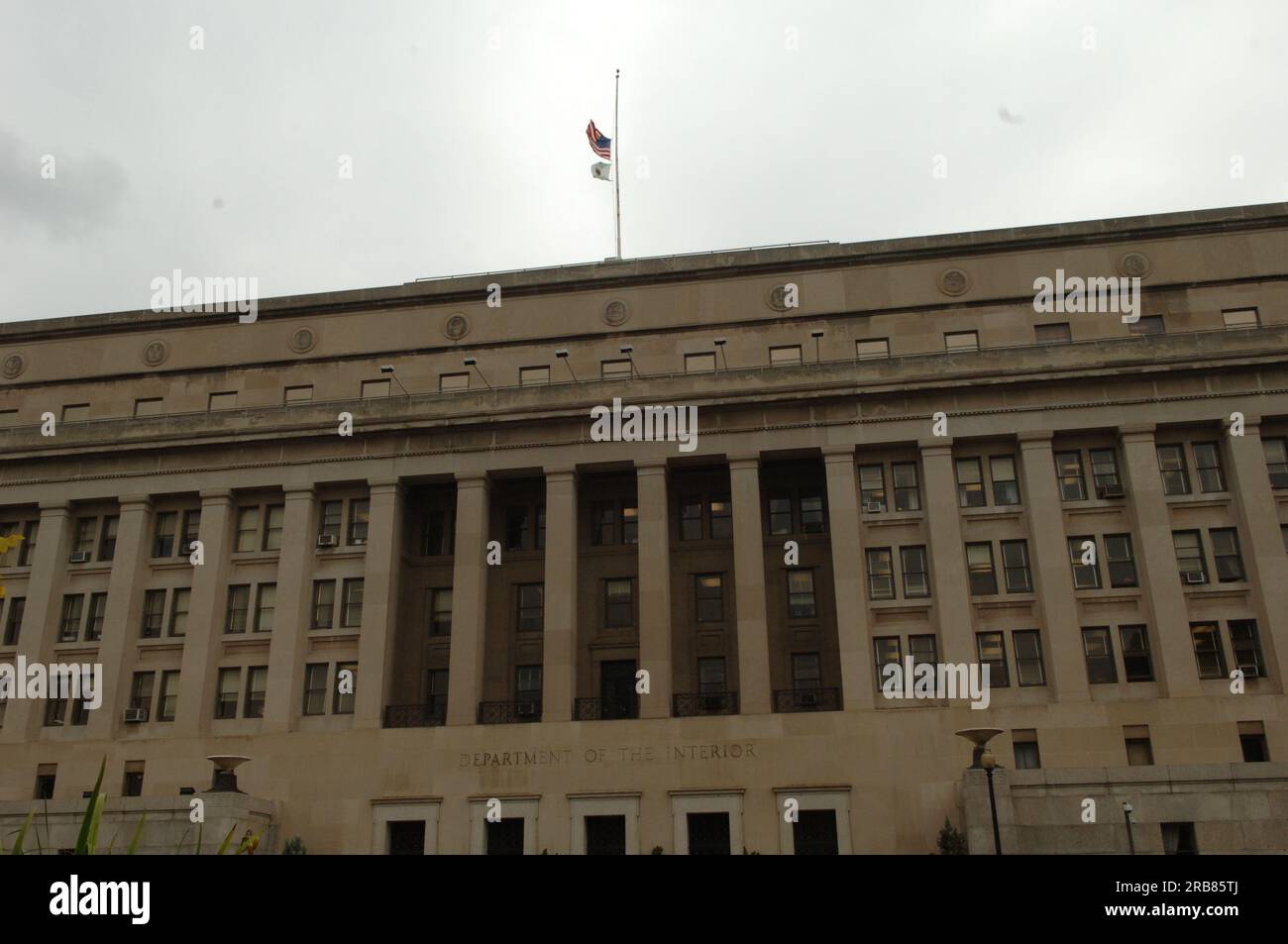 Views of the front of Main Interior Building, flag Stock Photo - Alamy