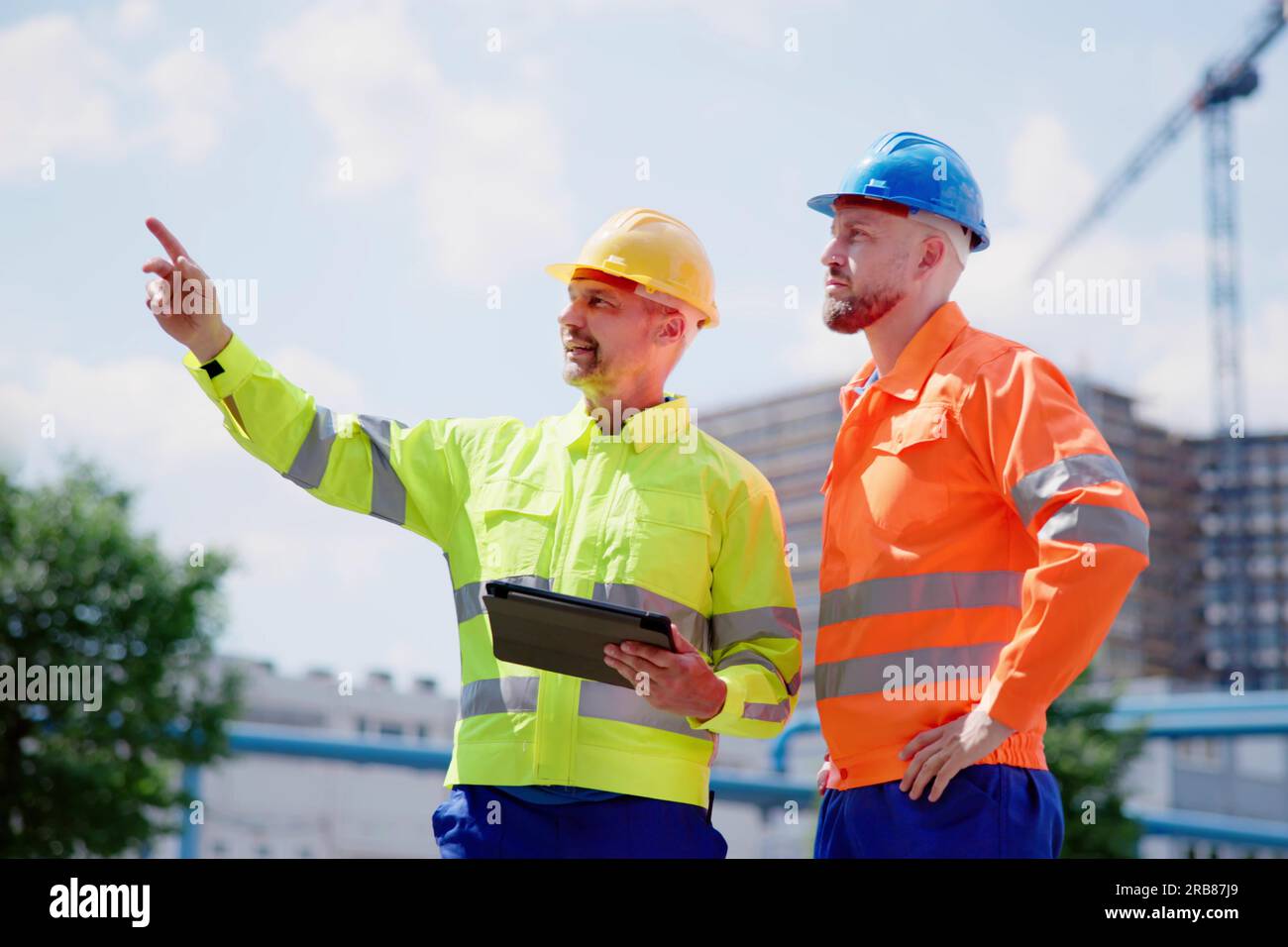 OSHA Inspector At Construction Site. Engineer Workers Stock Photo - Alamy