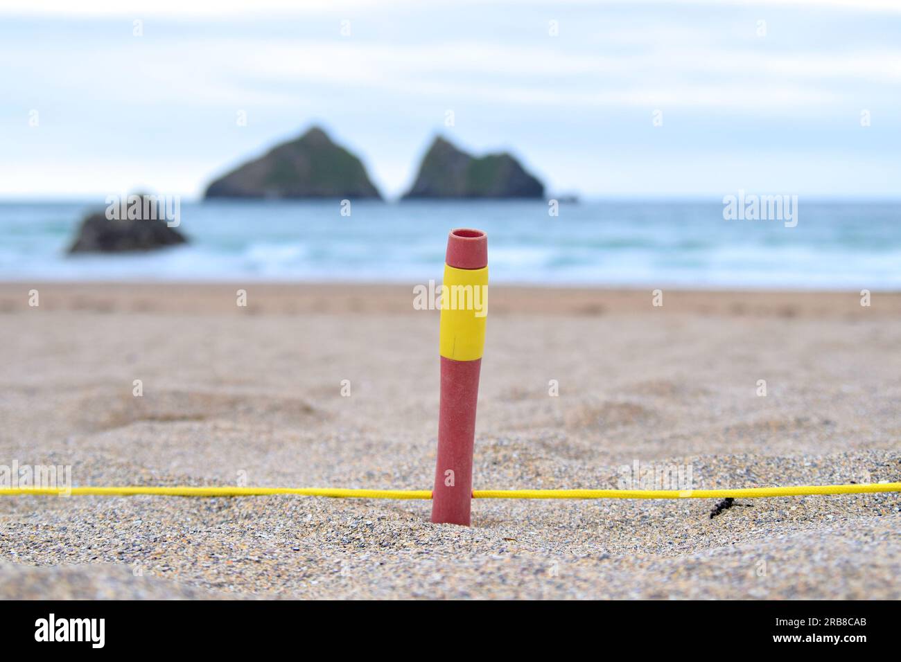 Surf lifesaving flag at competition, isolated with surf and island ...