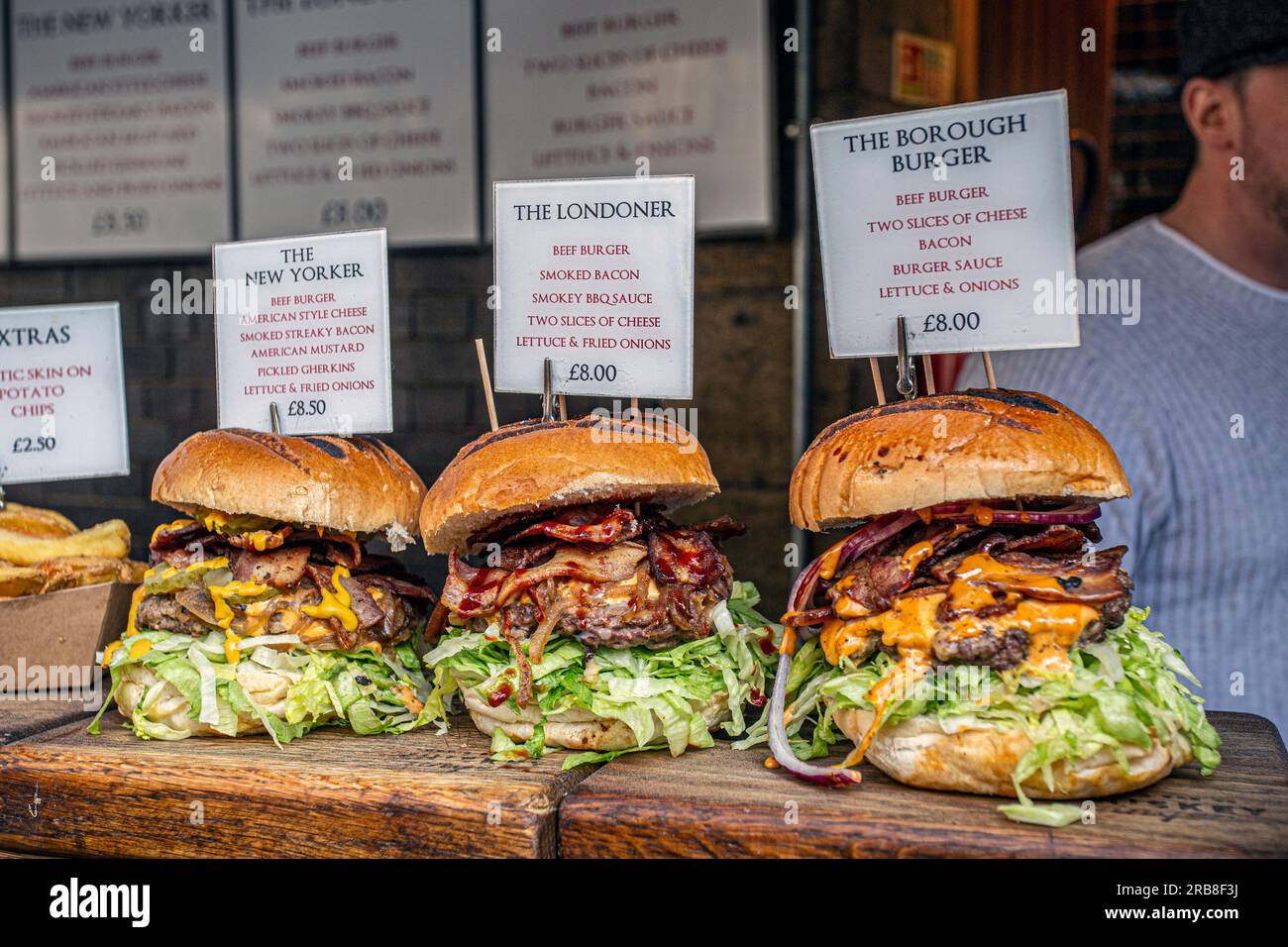 Beef burgers with cheese, bacon, lettuce, onions and pickles on sale at ...