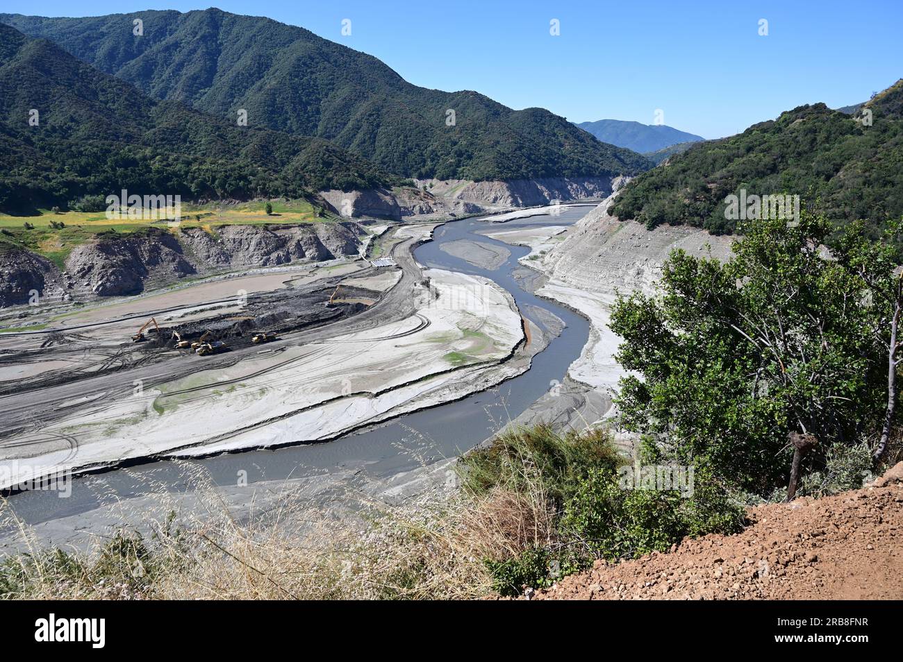 Heavy plant machinery removing silt from San Gabriel Reservoir No.1 in ...