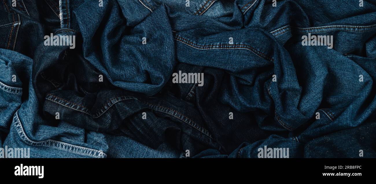 Denim background. Variety of crumpled blue jeans. Top view to stack of ...