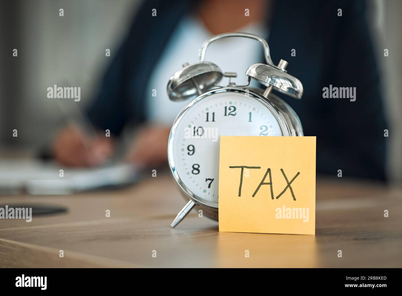 Taxes, clock and business person writing for financial report ...