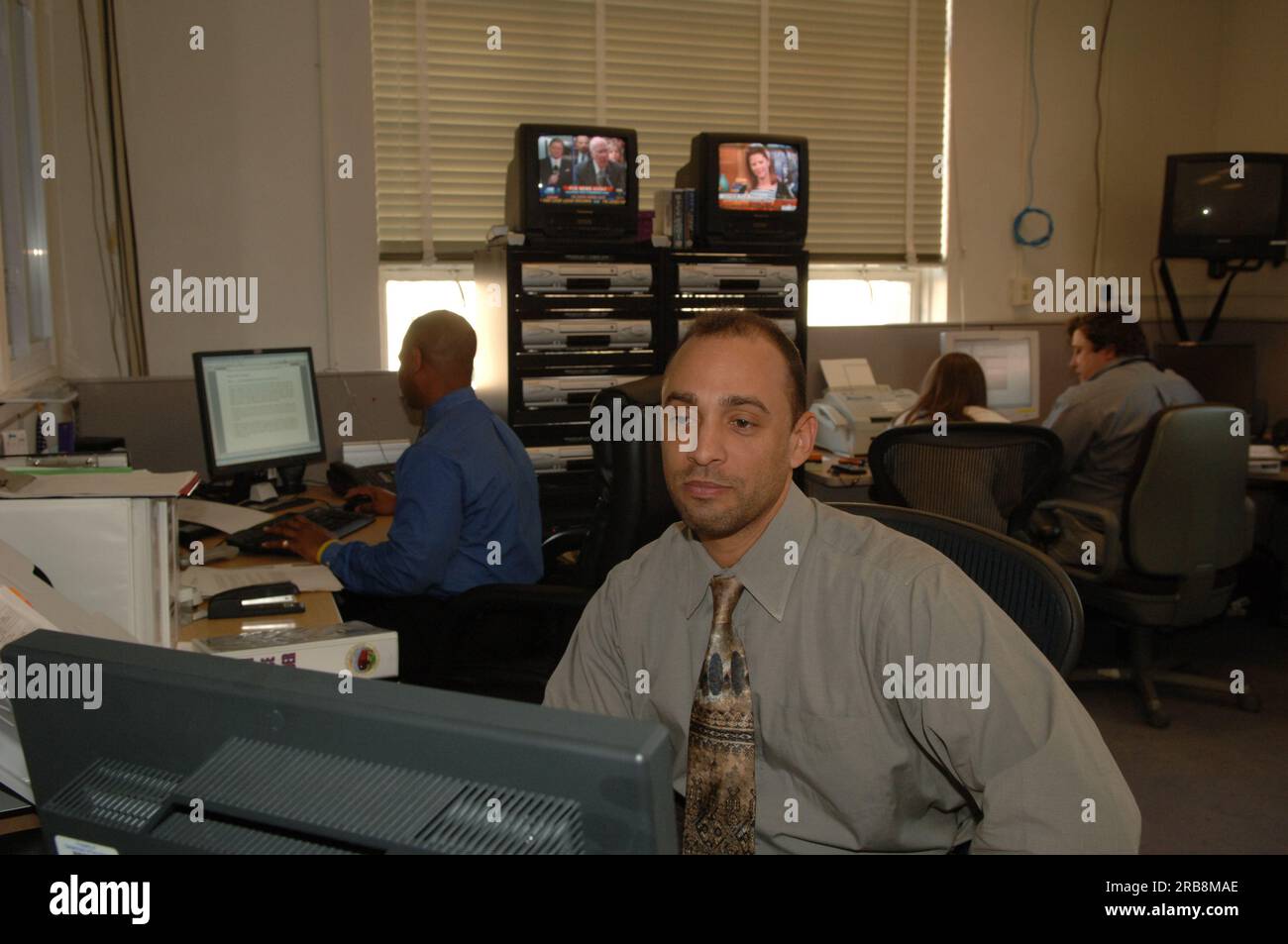 Staff at terminals, Interior Watch Office Stock Photo - Alamy