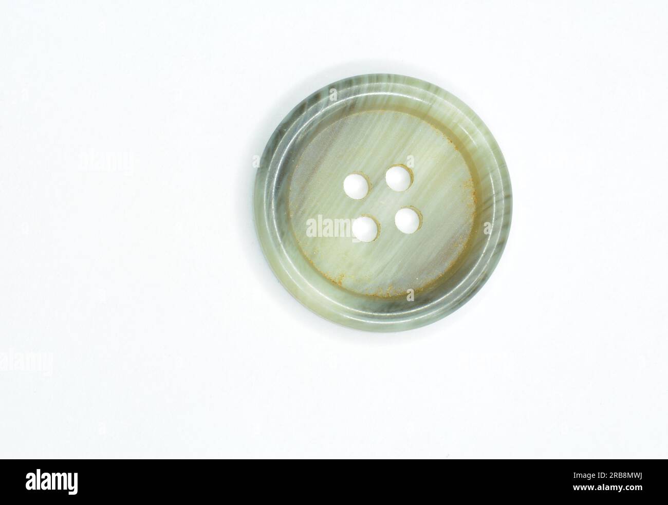 Vintage gray button that looks like imitation of wood Stock Photo - Alamy