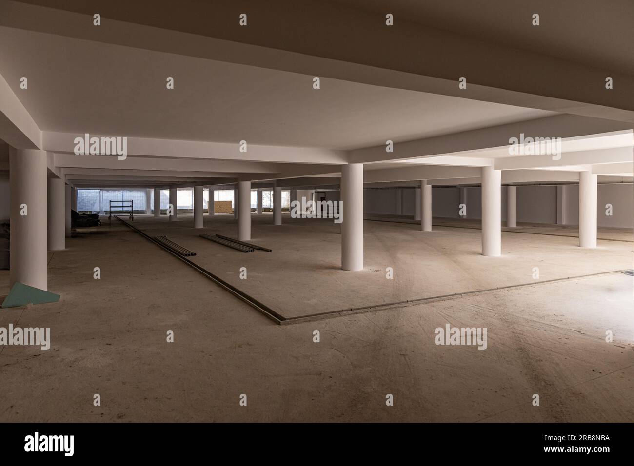 Underground parking lot under construction. Concrete interior of ...