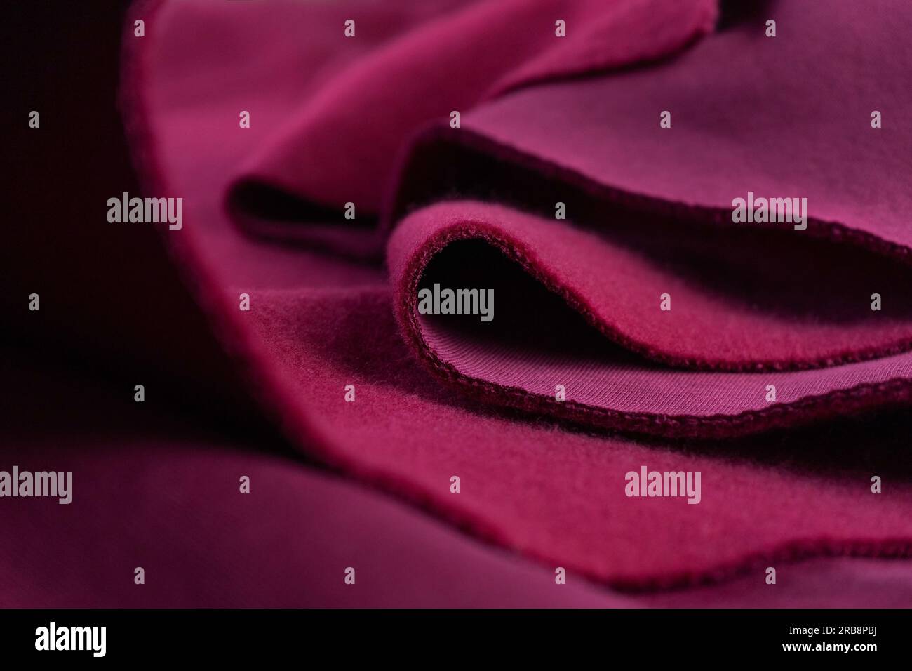 layers of French terry pink amaranth fabric. cut for sewing Stock Photo ...