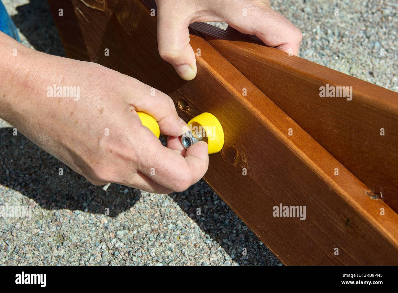 Assembly of outdoor furniture for childrens playground, assembler uses ...