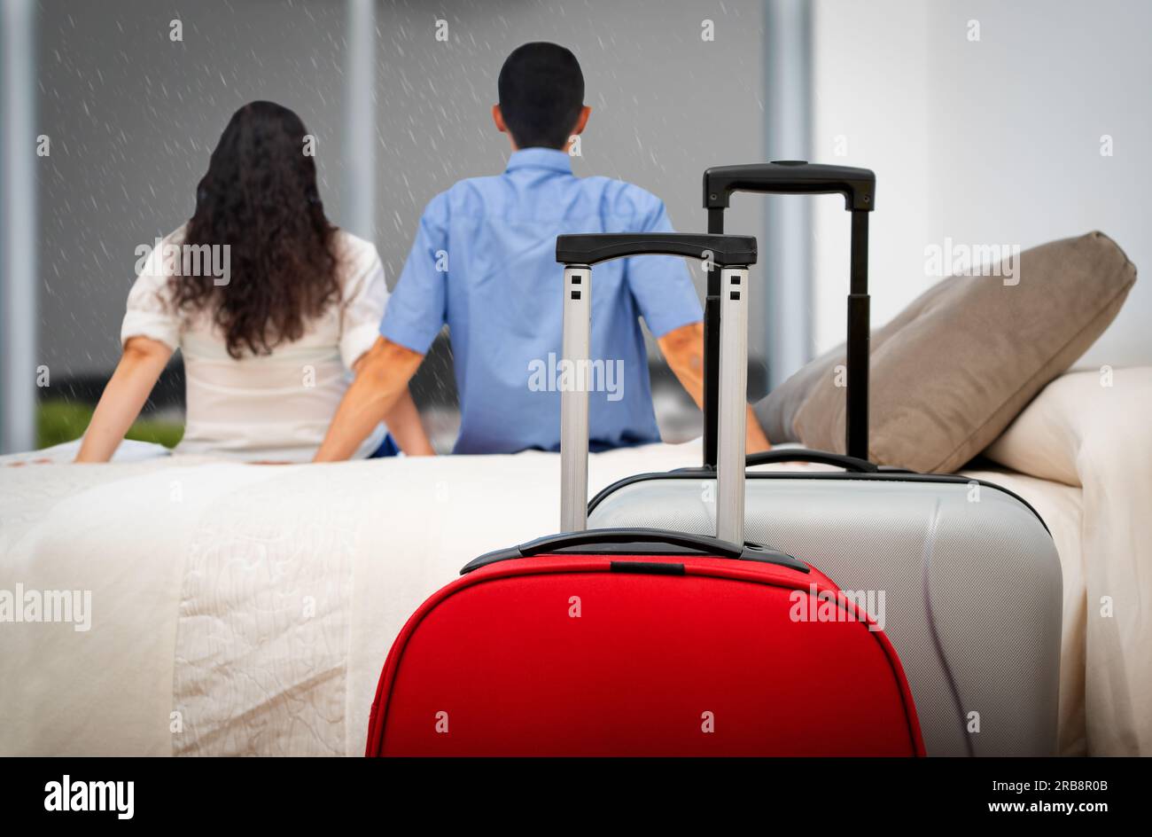 Back view of a couple of tourists relaxing looking through a window in ...