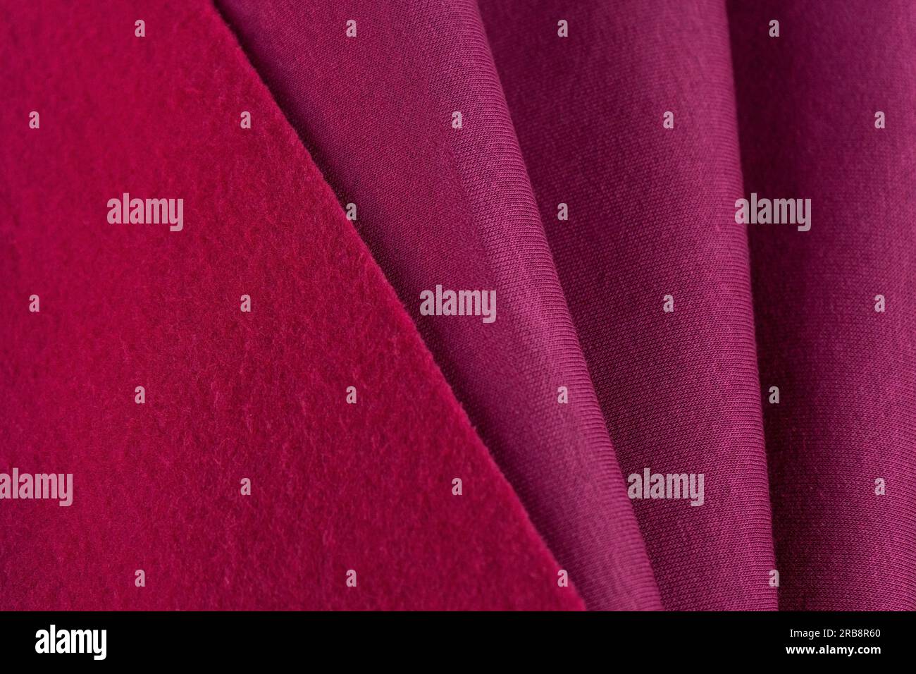 layers of French terry pink amaranth fabric. cut for sewing Stock Photo ...