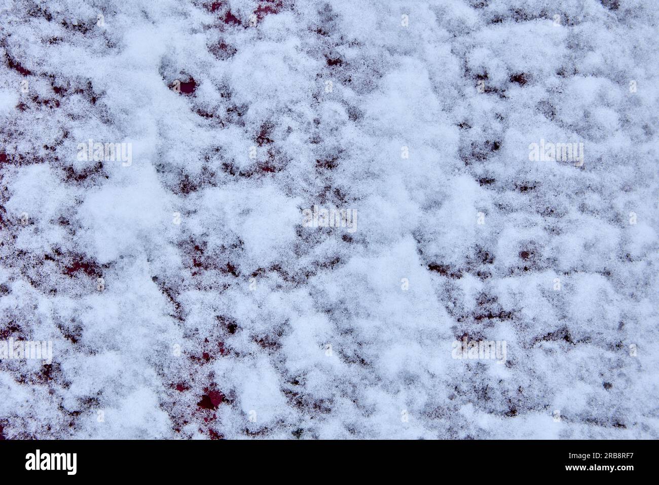 Wet melted snow stuck to wooden wall Stock Photo - Alamy