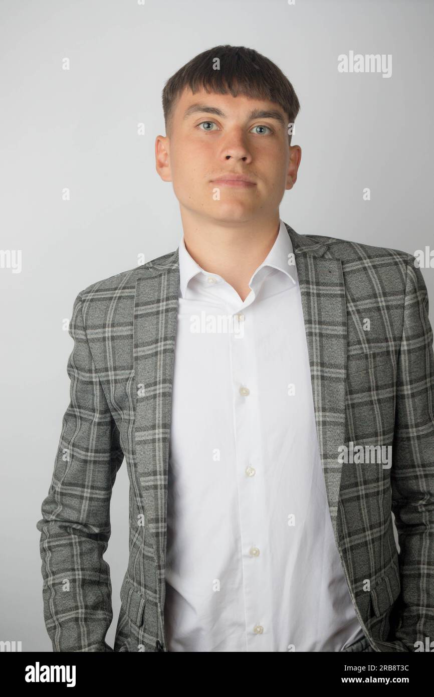 Young entrepreneur wearing a suit jacket and open neck shirt without a ...