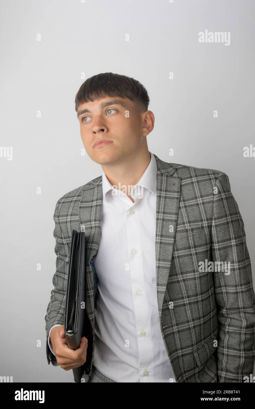 Young entrepreneur wearing a suit jacket and open neck shirt without a ...