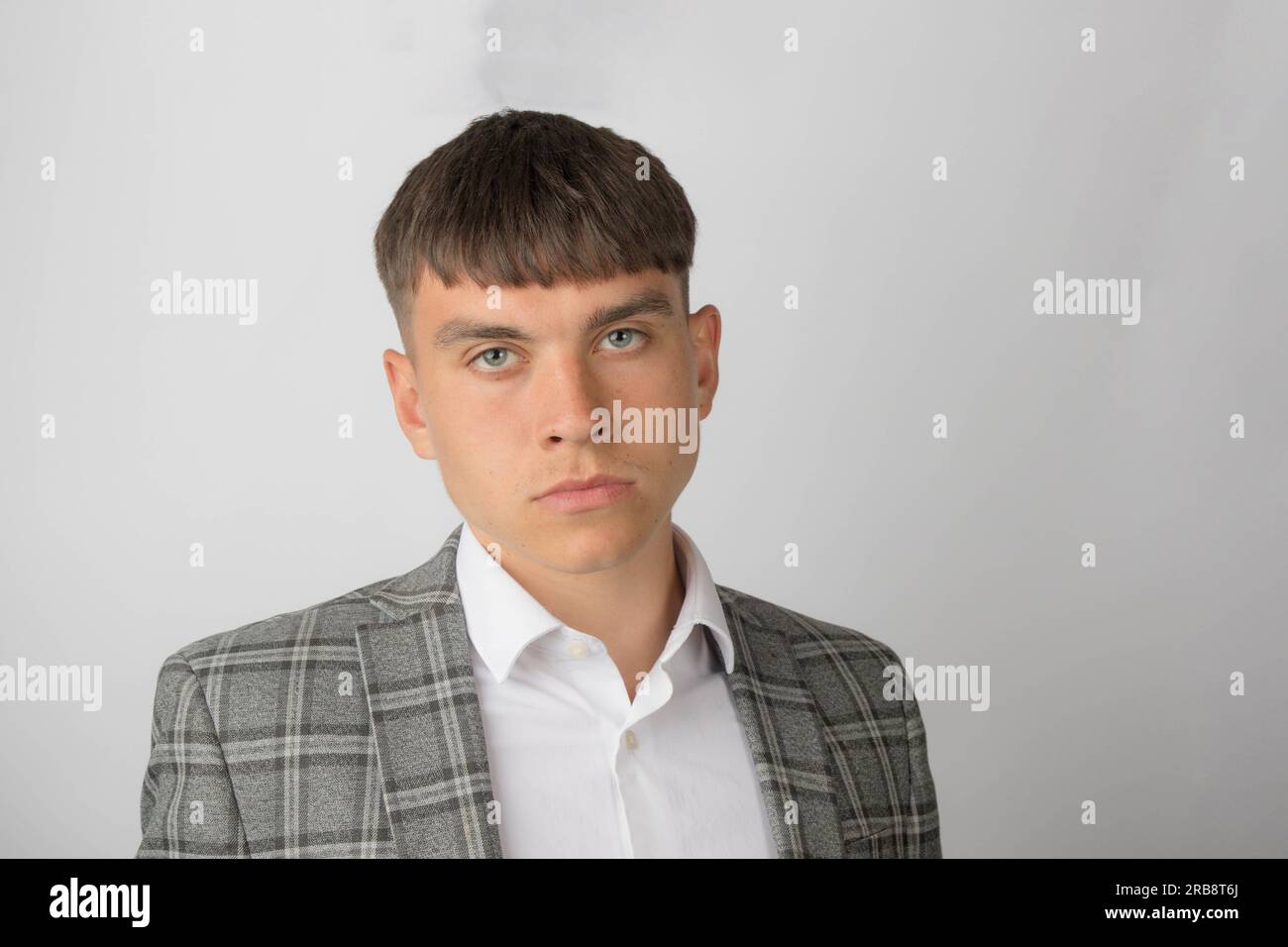 Young entrepreneur wearing a suit jacket and open neck shirt without a ...