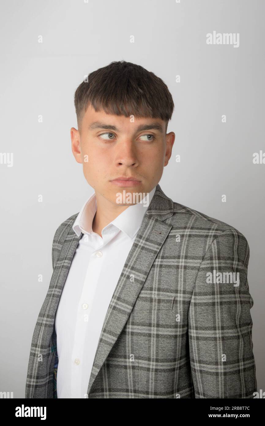 Young entrepreneur wearing a suit jacket and open neck shirt without a ...