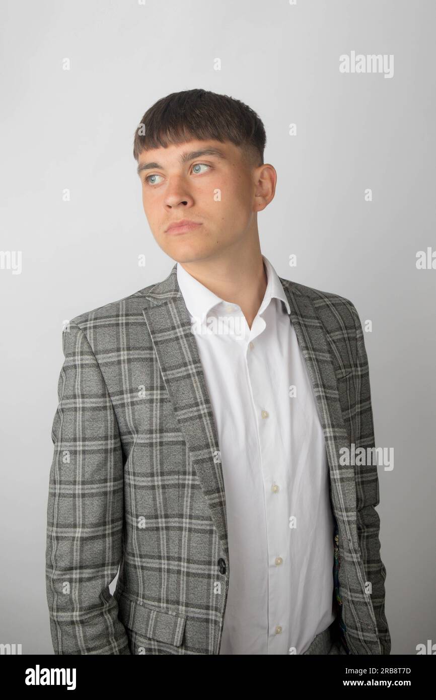 Young entrepreneur wearing a suit jacket and open neck shirt without a ...