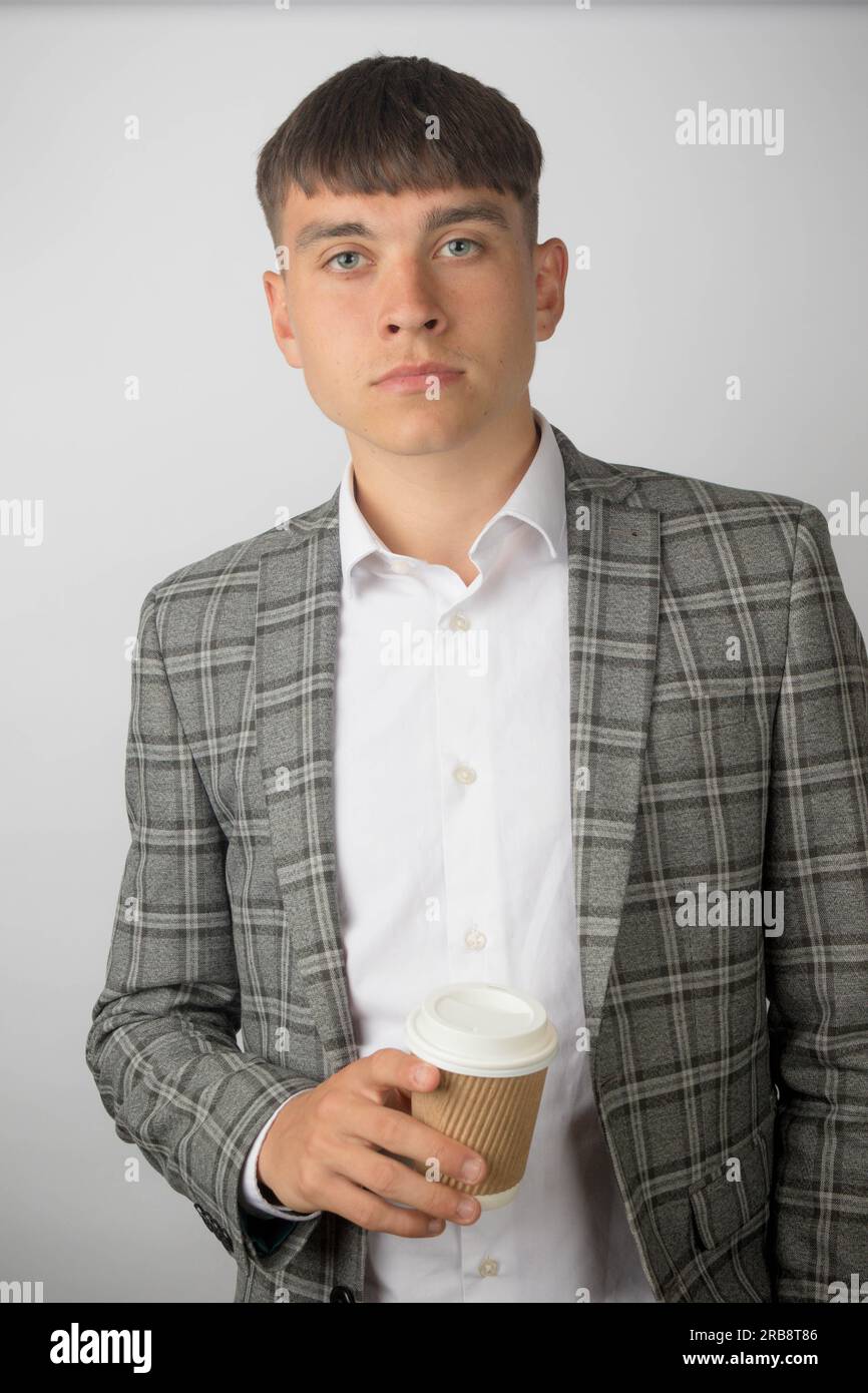 Young entrepreneur wearing a suit jacket and open neck shirt without a ...