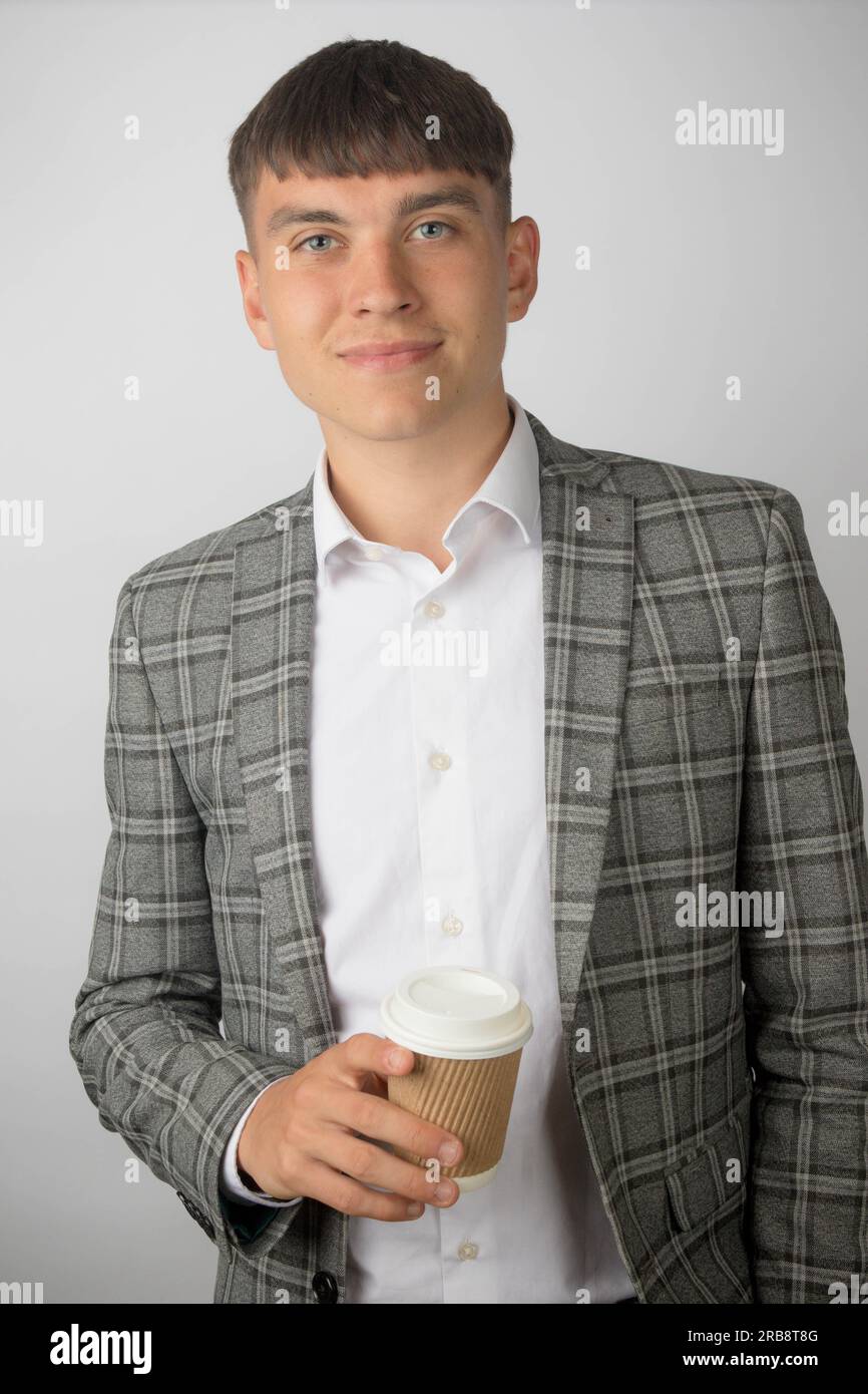 Young entrepreneur wearing a suit jacket and open neck shirt without a ...