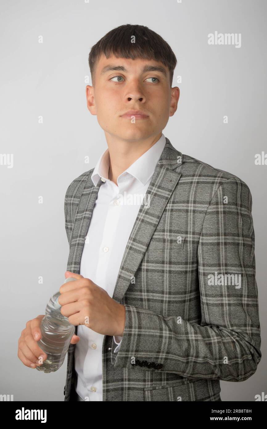 Young entrepreneur wearing a suit jacket and open neck shirt without a ...